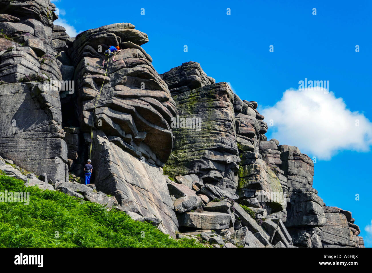 Rock climbers on Stanage Edge, Gritstone, Peak District, National Park ...