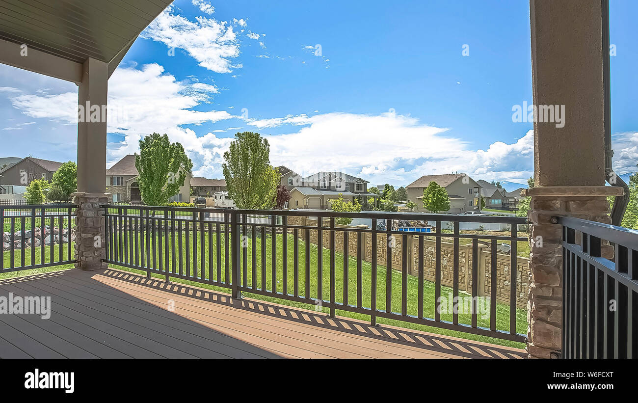 Panorama frame Balcony overlooking the yard houses and blue sky with ...