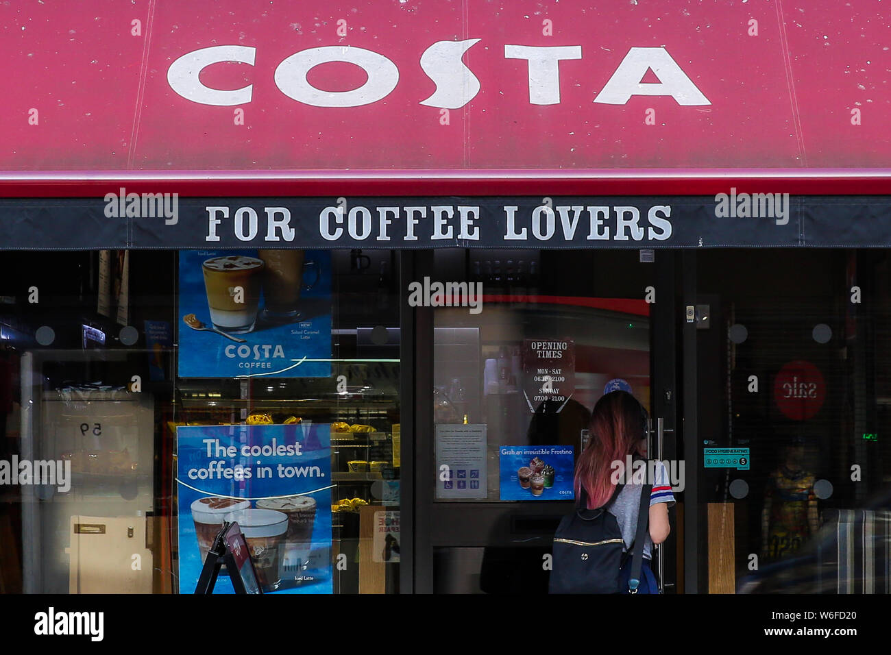 A customer enters a Costa Coffee shop in London Stock Photo - Alamy