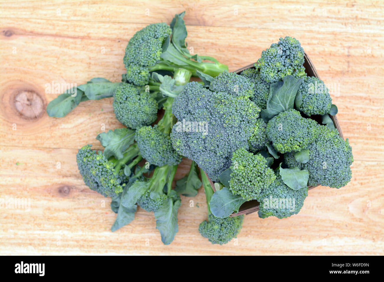 fresh broccoli in crate isolated on table Stock Photo - Alamy