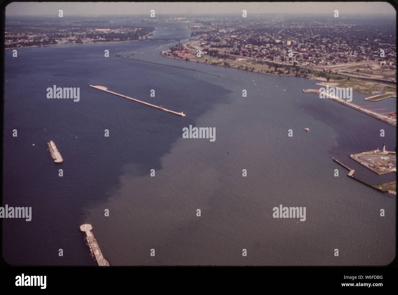 BUFFALO WATERFRONT. DISCOLORED AREA IS POLLUTED WATER FLOWING INTO LAKE ...