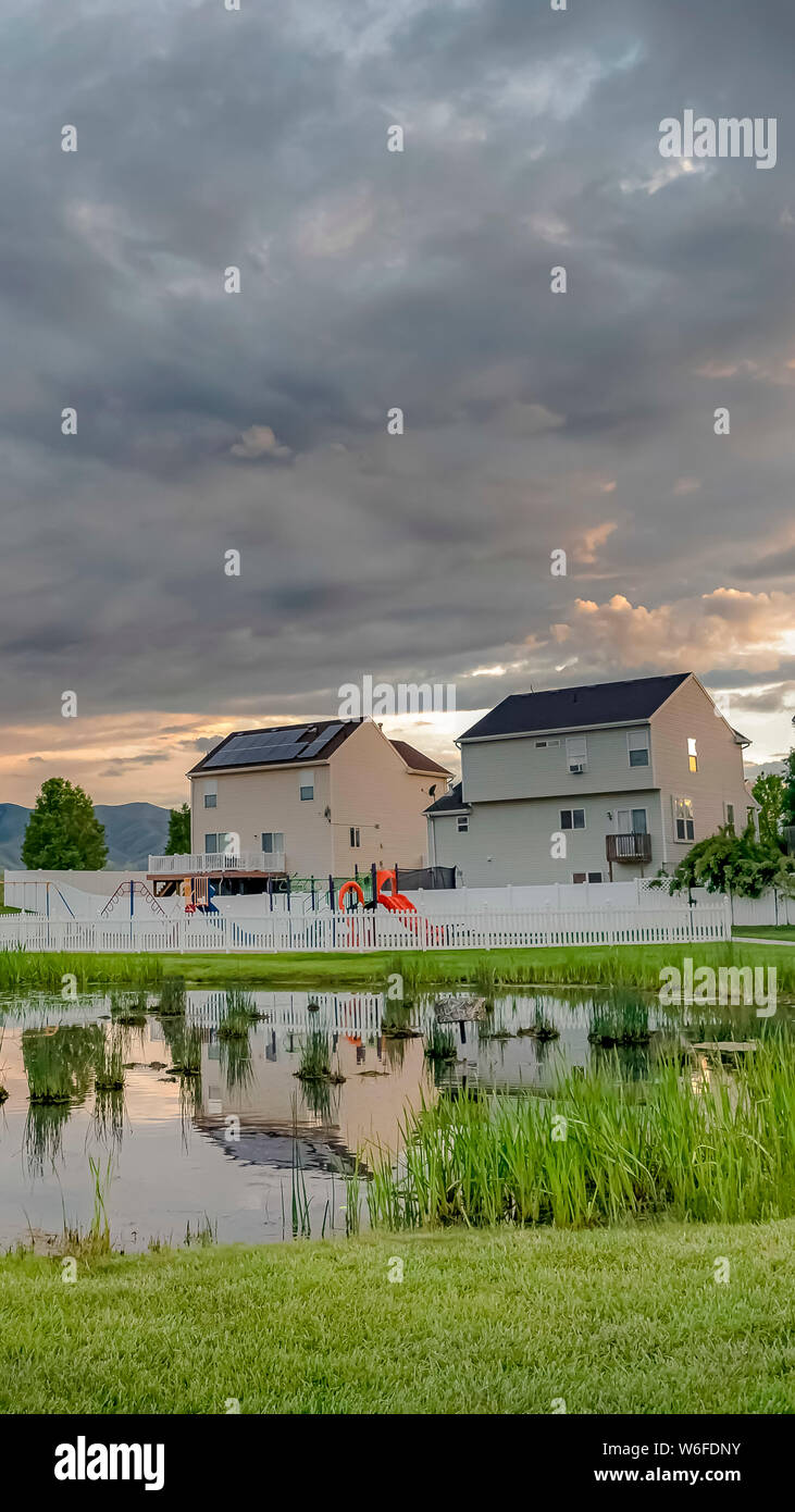 Vertical Shiny pond playground and multi storey homes surrounded by ...
