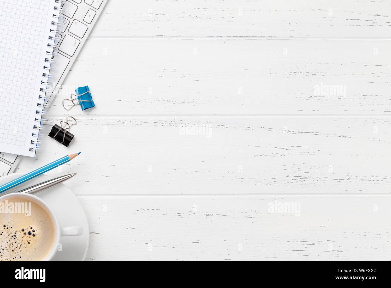 Office workplace table with coffee cup, supplies and computer. Flat lay ...