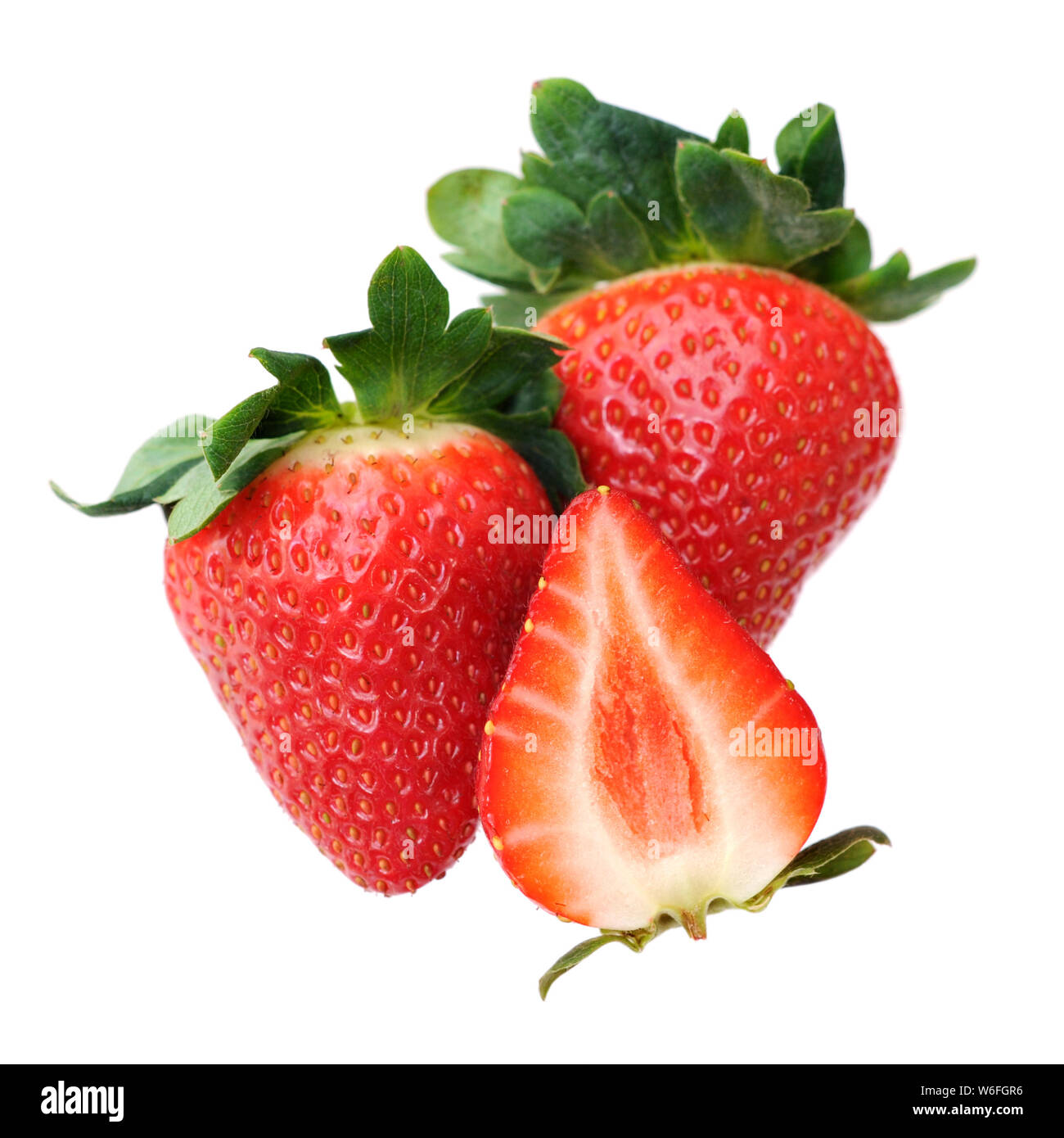 half and whole section of strawberry isolated on white Stock Photo - Alamy