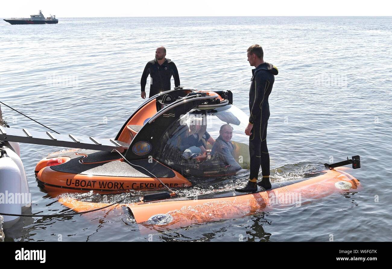 Russian President Vladimir Putin sits inside the C-Explorer 3.11 ...