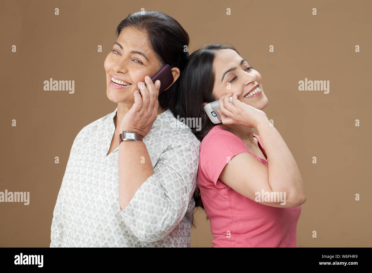 Indian family talking on mobile hi-res stock photography and images - Alamy