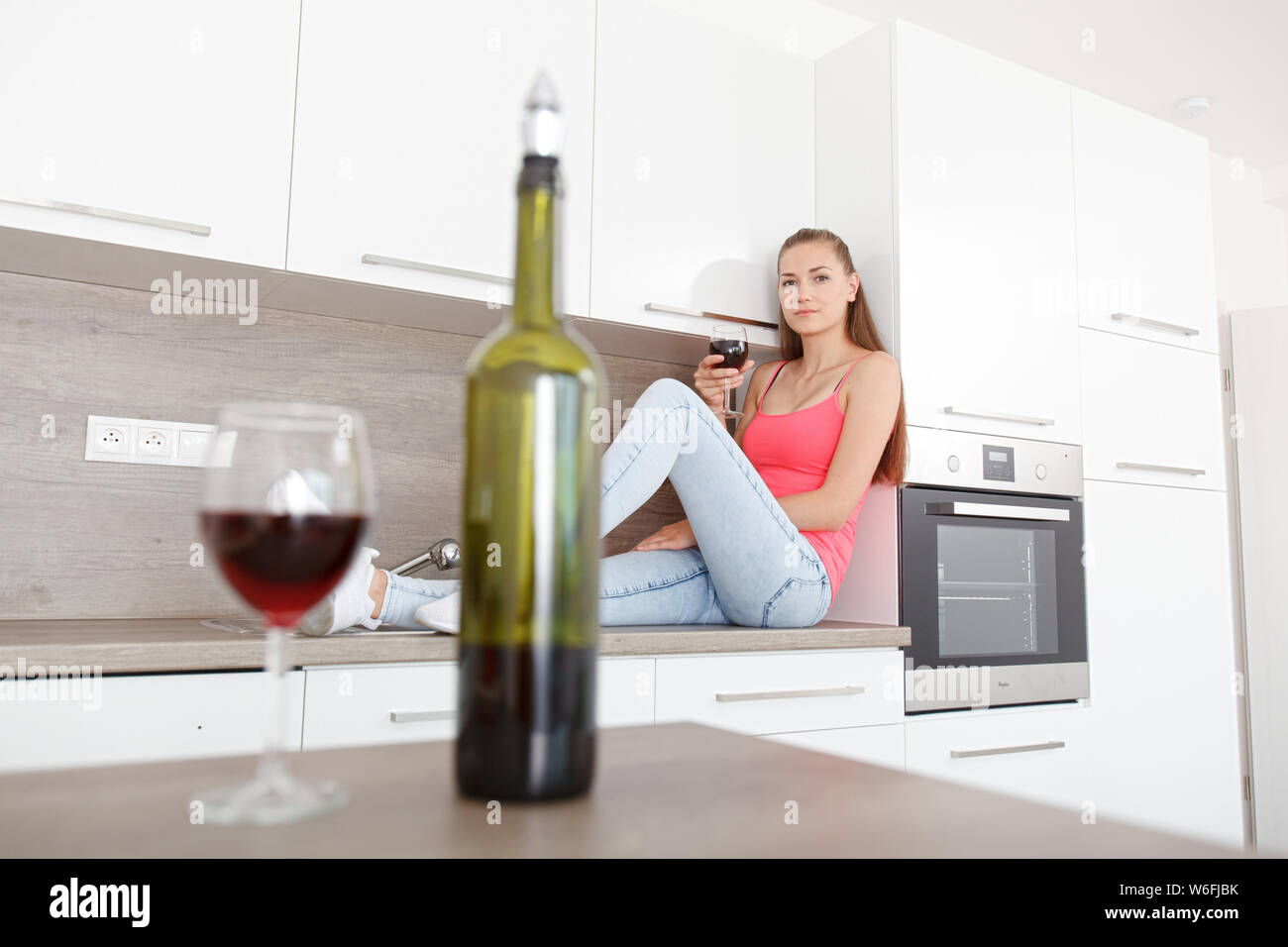 Young woman solves problems with alcohol. Alcohol addiction. (Color ...