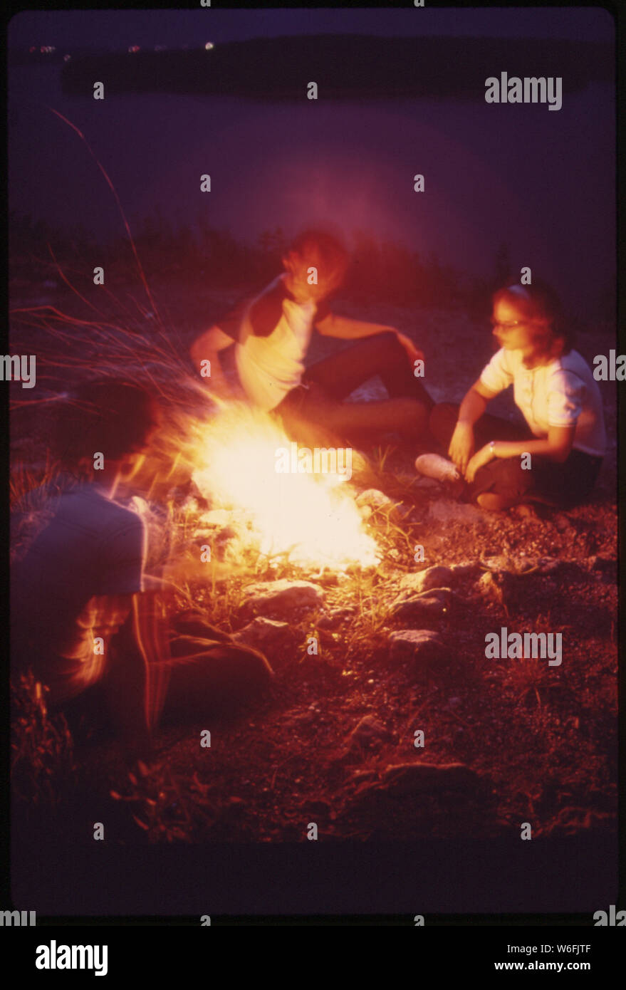 CAMDENTON HIGH SCHOOL STUDENTS SIT AROUND BONFIRE ON A BLUFF ...