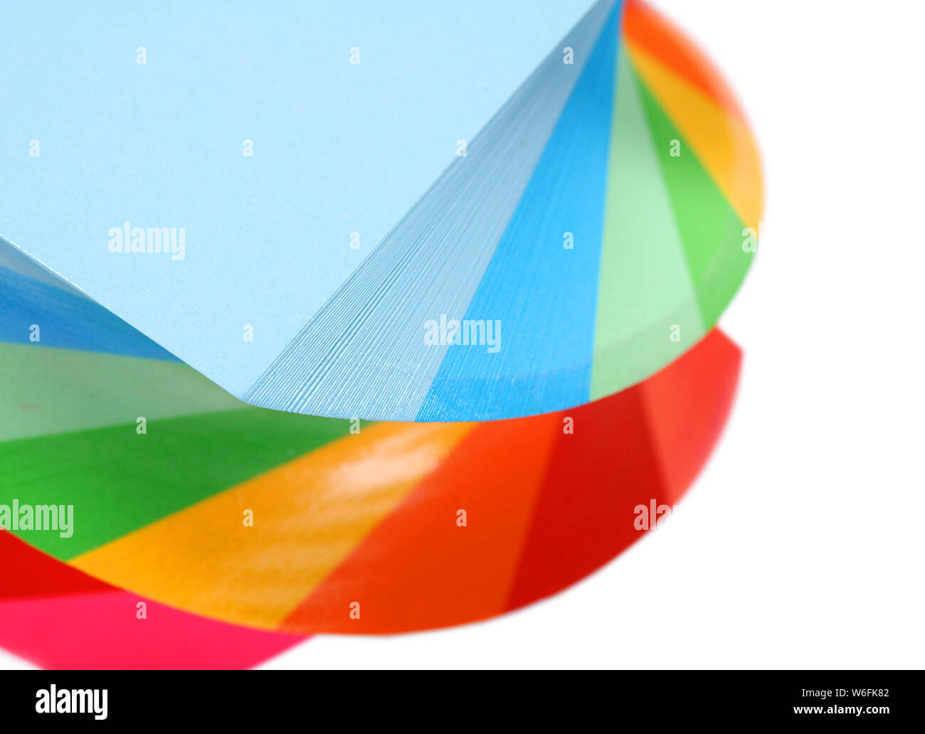 a pile of colorful note paper isolated on white Stock Photo - Alamy