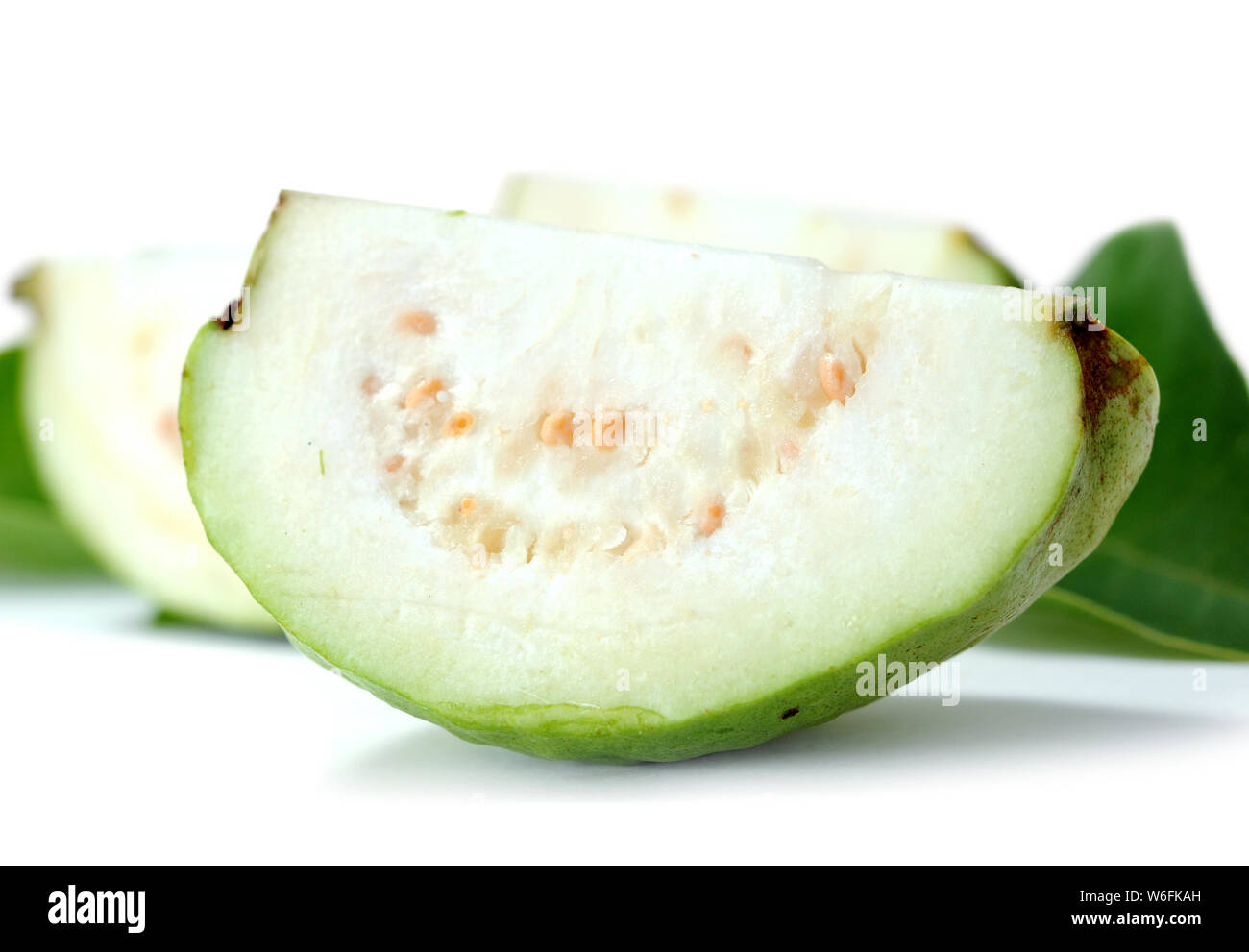 chopped green guava (delicious tropical fruit) on white Stock Photo - Alamy
