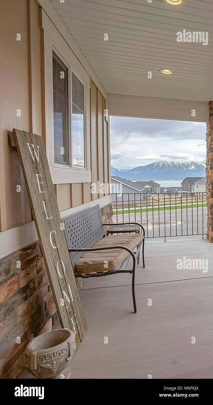 Vertical Porch overlooking yard road homes lake and mountain under ...