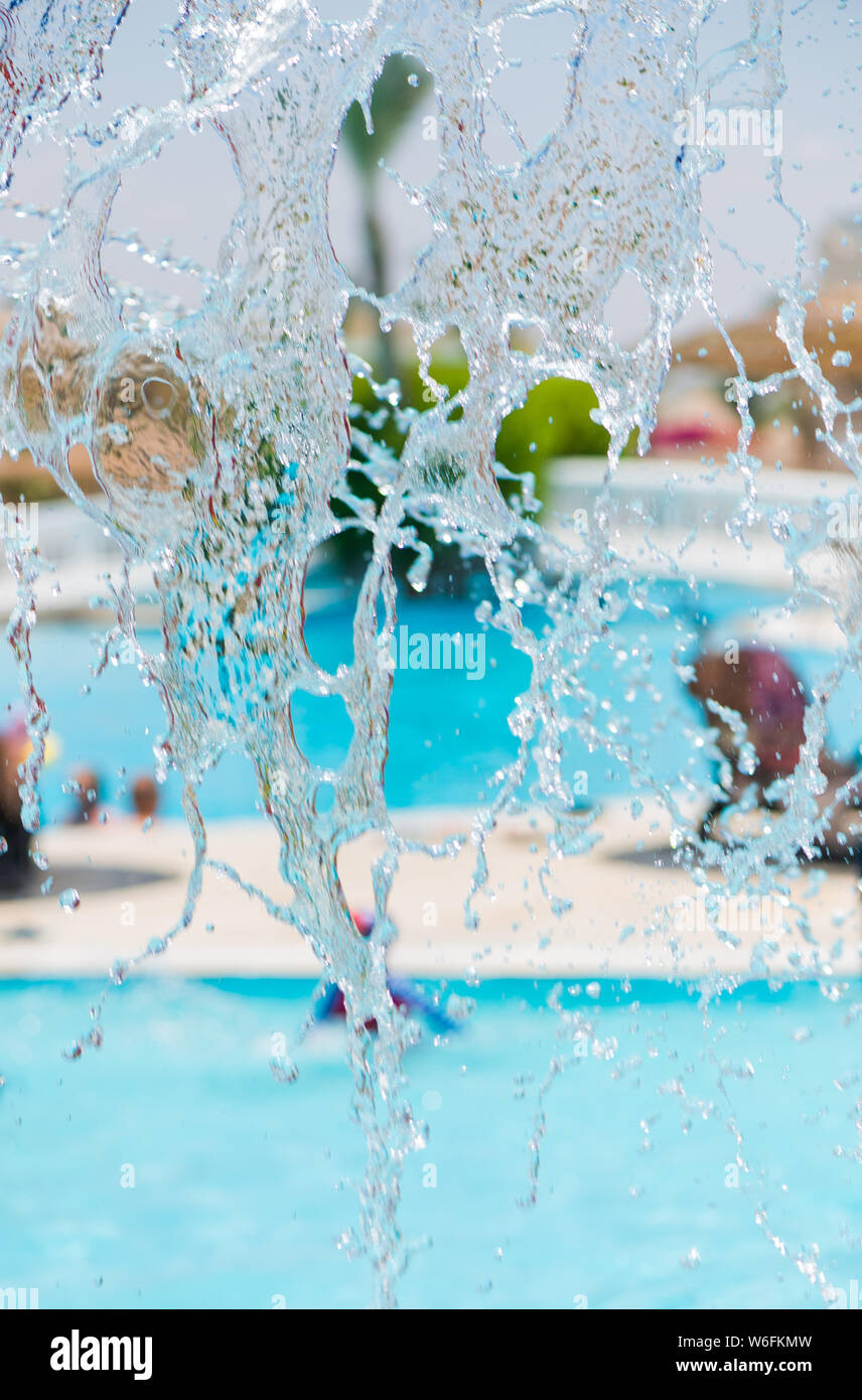 splashing water surface at sunny pool activities background Stock Photo ...