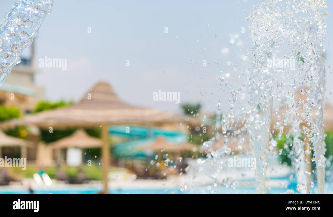splashing water surface at sunny pool activities background Stock Photo ...