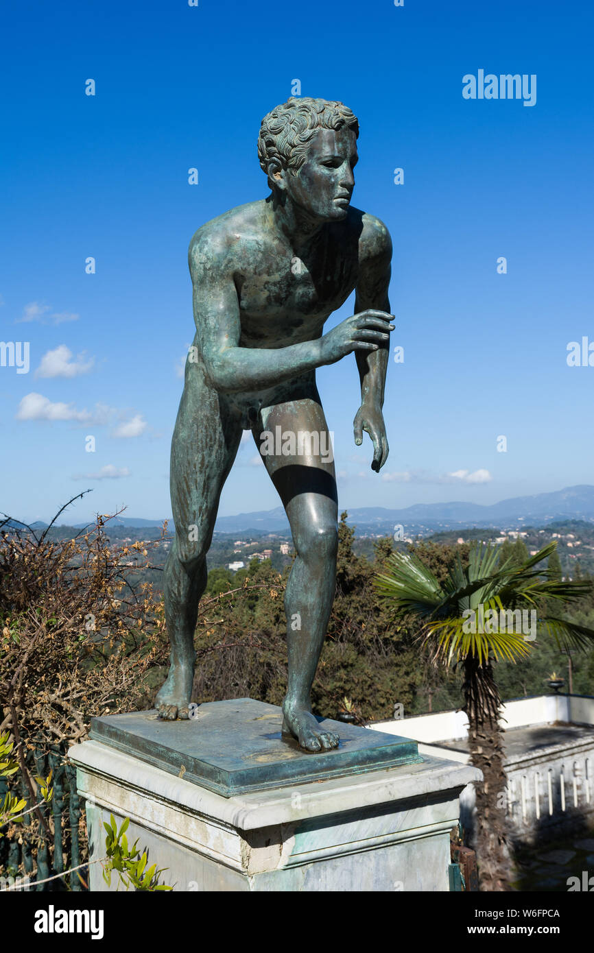 CORFU, GREECE - MARCH 4, 2017: A statue of The Runner in the garden of ...