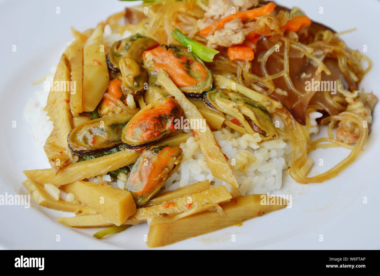 stir fried bamboo shoot with mussel and glass noodle on rice Stock ...