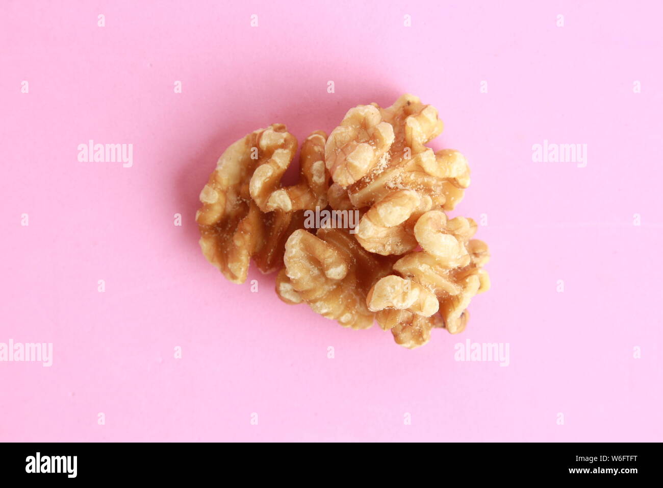 Peeled walnuts in colorful background Stock Photo - Alamy