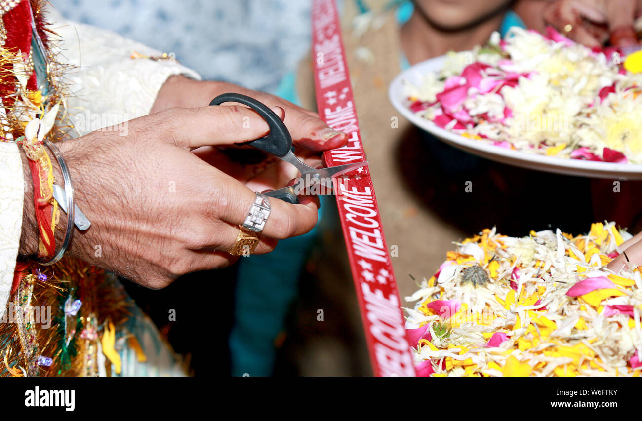 Cutting Ribbon in Indian Wedding Ritual Welcome Ceremony Stock Photo ...