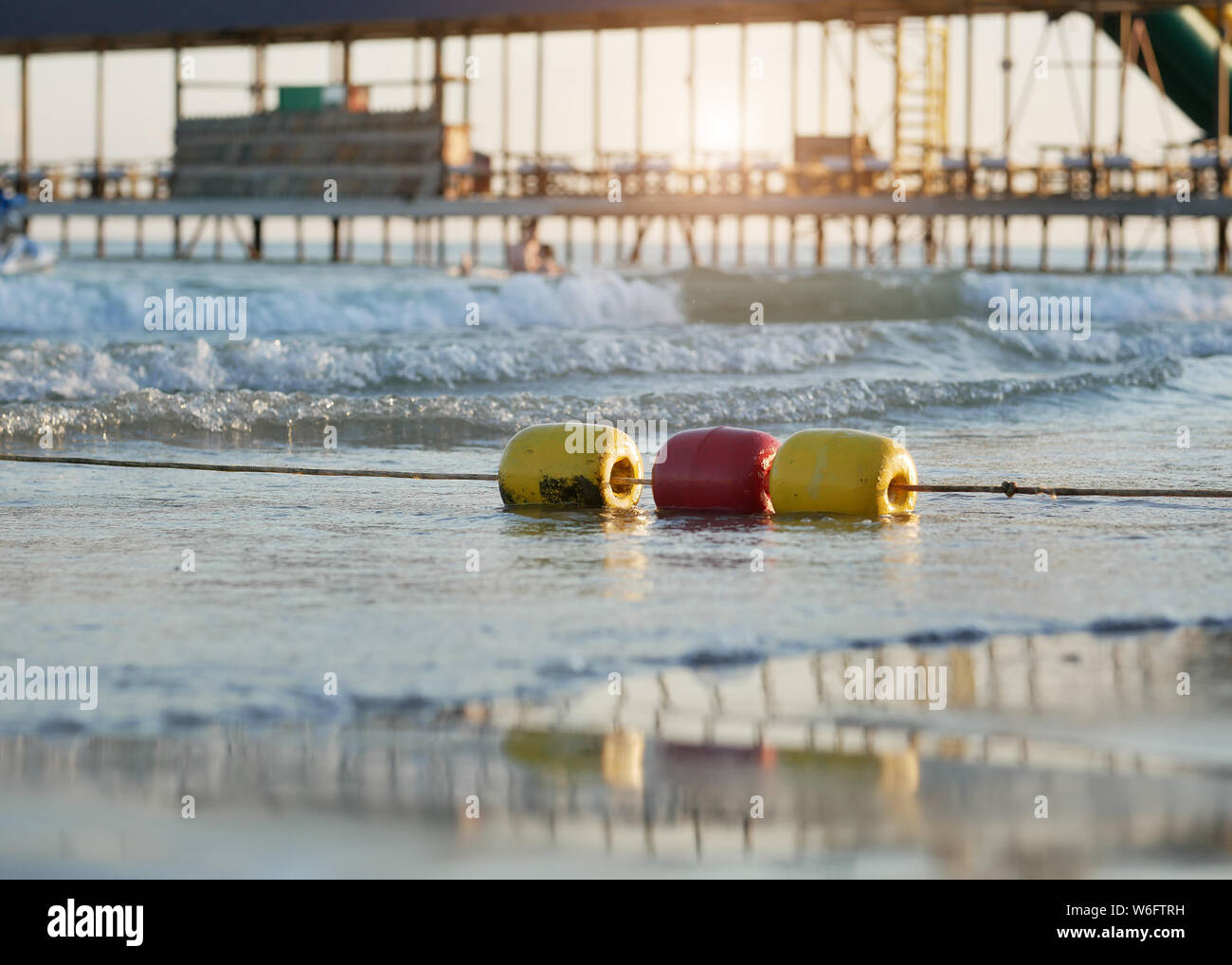 colorful enclosing buoys on the sea Stock Photo - Alamy