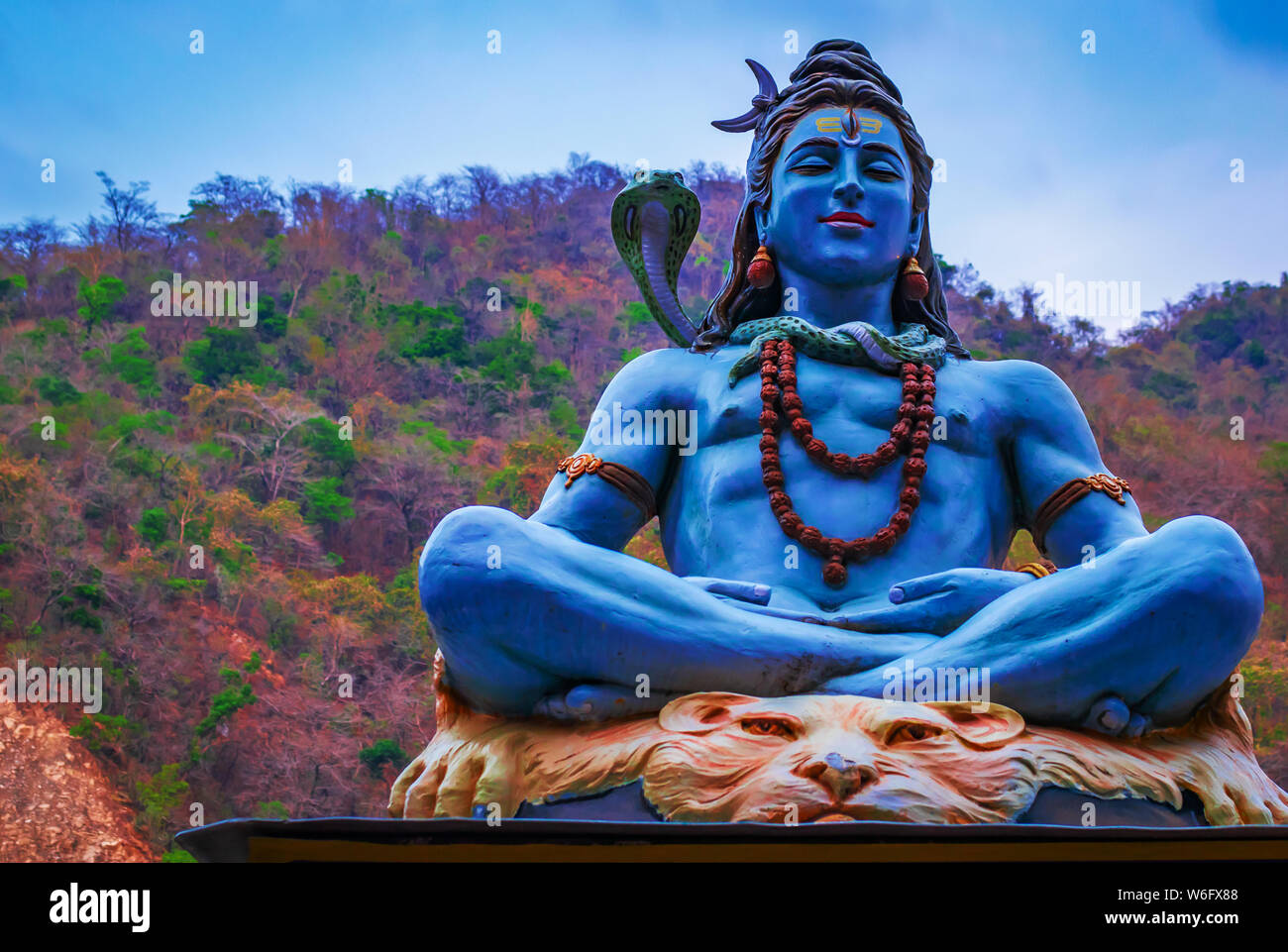 River Ganges, the famous bridge Laxman Jhula surrounded by temples and ...