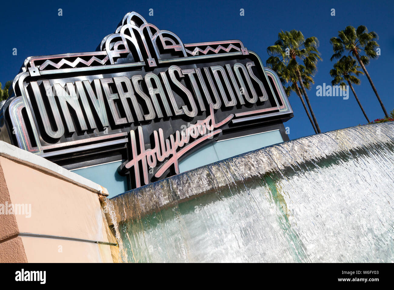 Universal Studios Hollywood neon sign greets visitors under the sunny ...