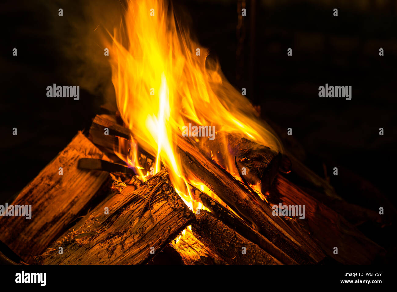 Hot fire flames of wood fire in cold winter night Stock Photo - Alamy