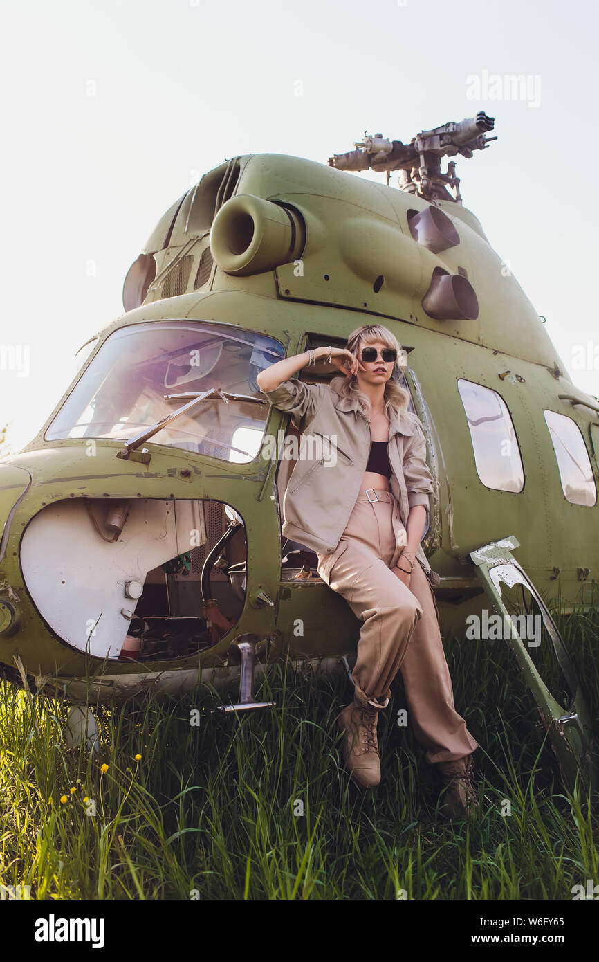 Female pilot in cockpit of helicopter before take off. Young woman helicopter pilot Stock Photo ...