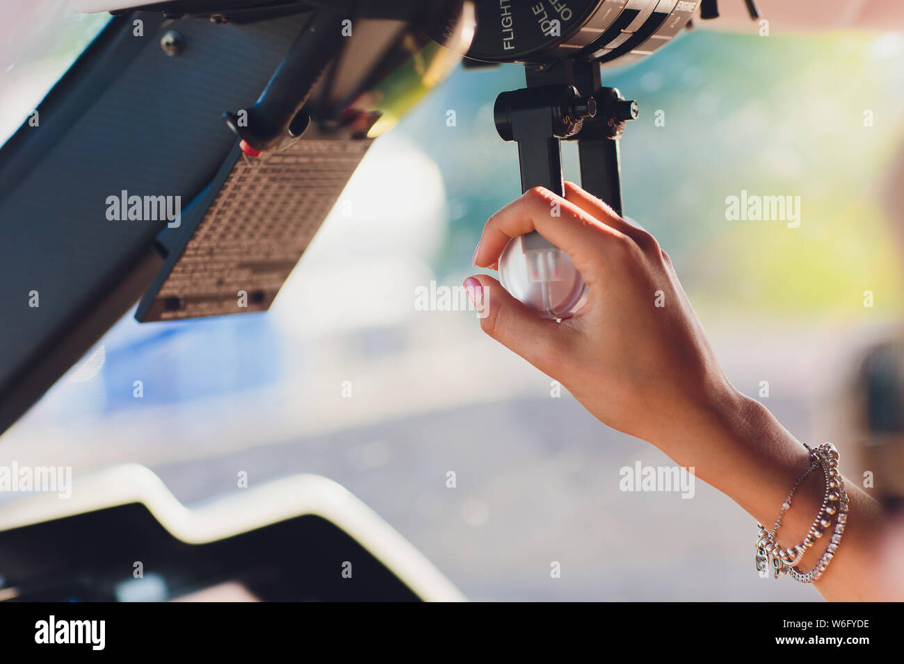 Right hand of air force pilot push on and switching control panel of ...