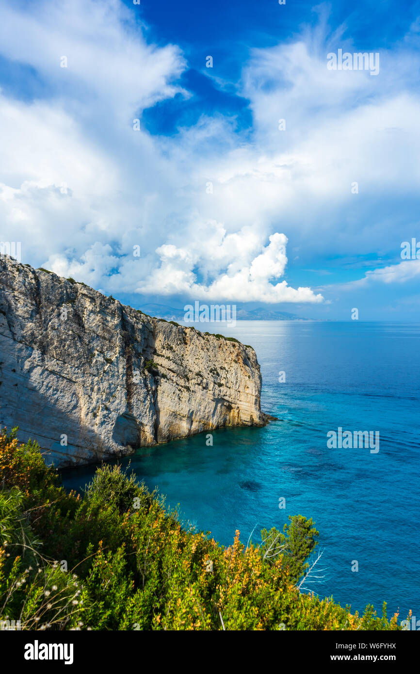 Greece, Zakynthos, Dramatic cloudscape sky over pretty white cliff at ...
