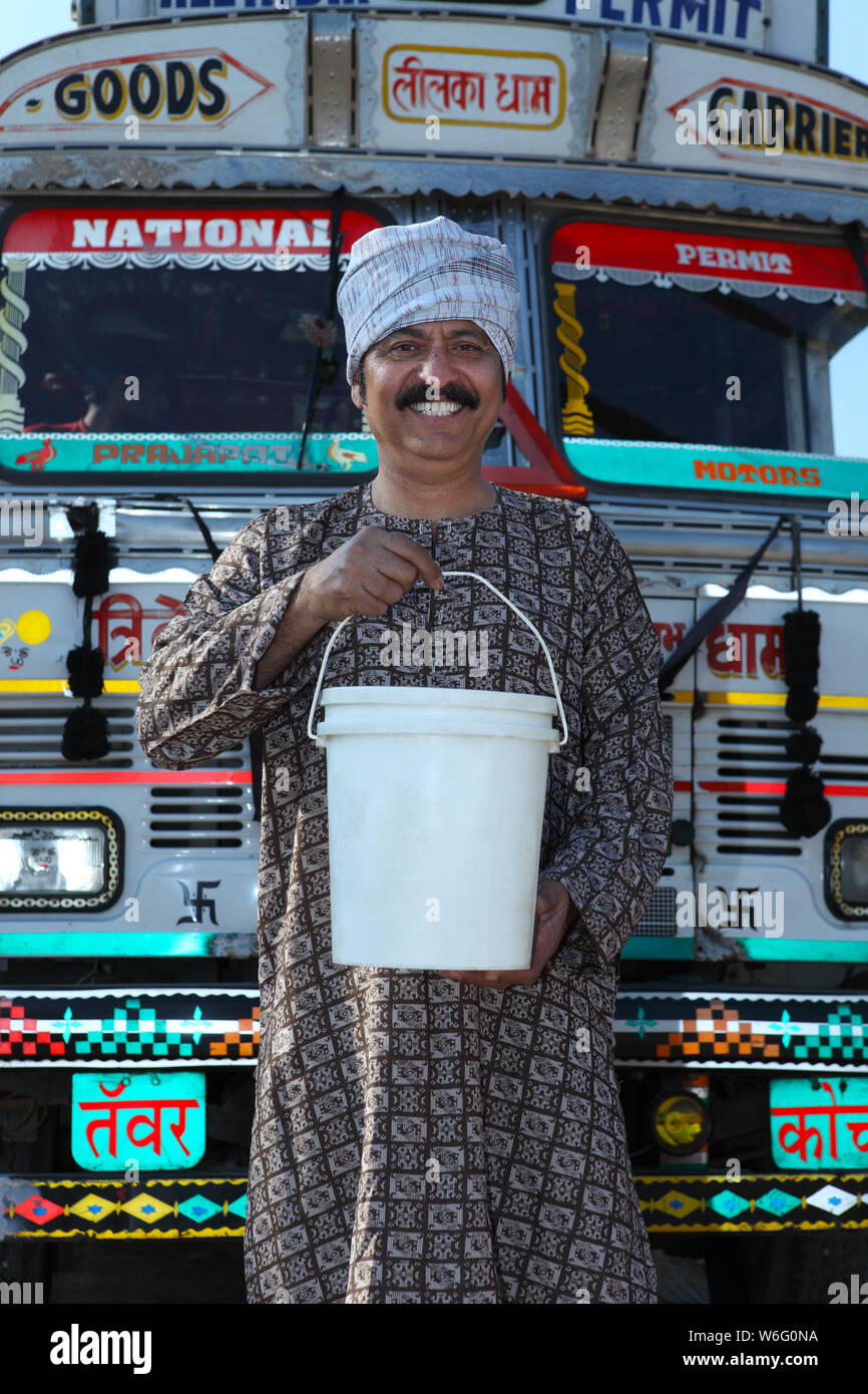 Old man carrying a bucket hi-res stock photography and images - Alamy