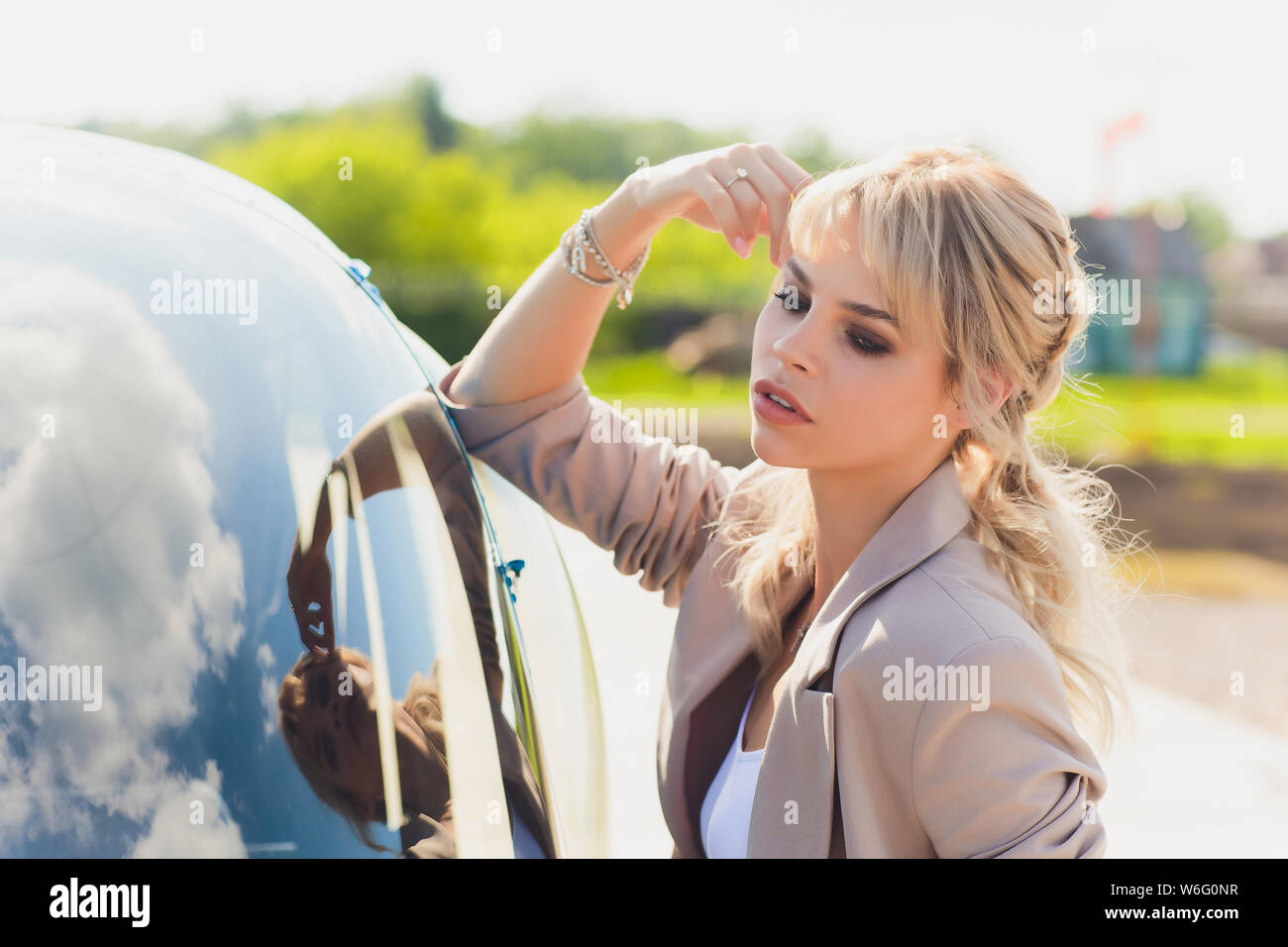 Female pilot in cockpit of helicopter before take off. Young woman ...