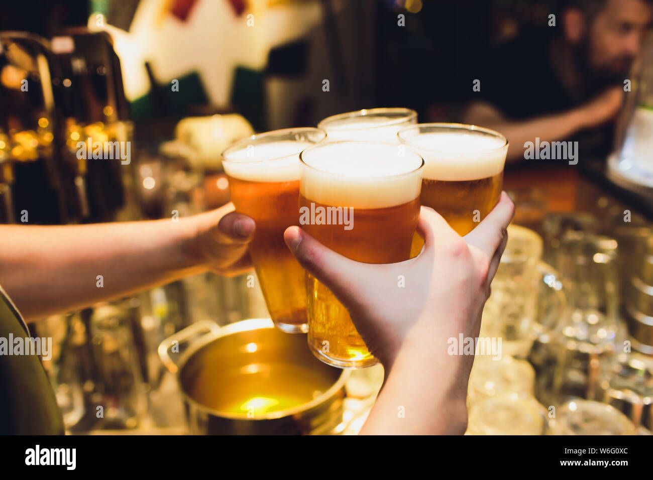 Woman holds a beer in hands hi-res stock photography and images - Alamy