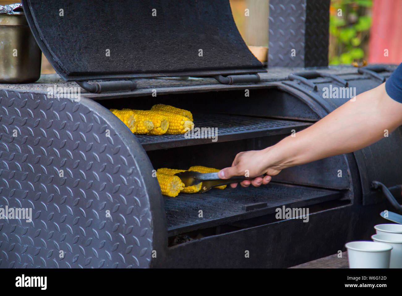 Chef cooking healthy yellow corn Stock Photo - Alamy
