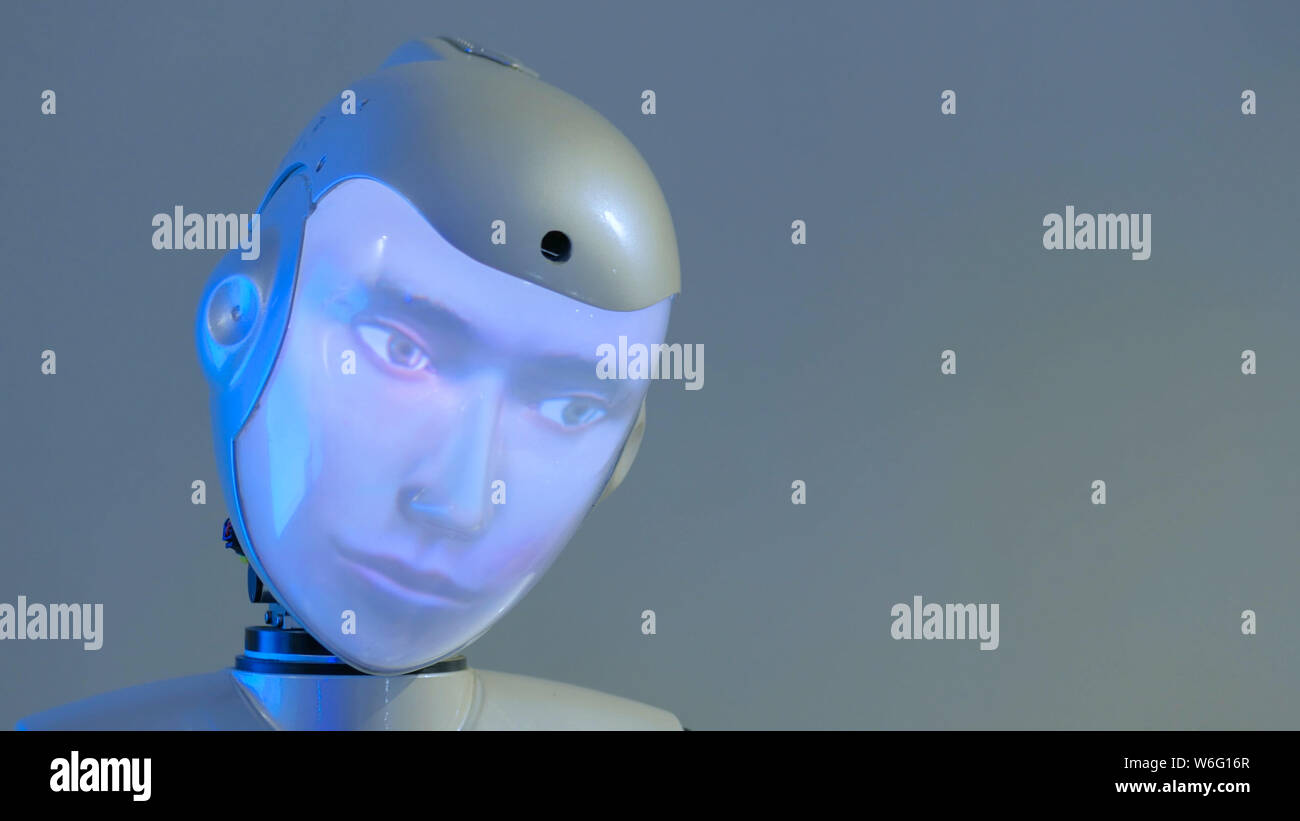 Funny humanoid robot with display face Stock Photo - Alamy
