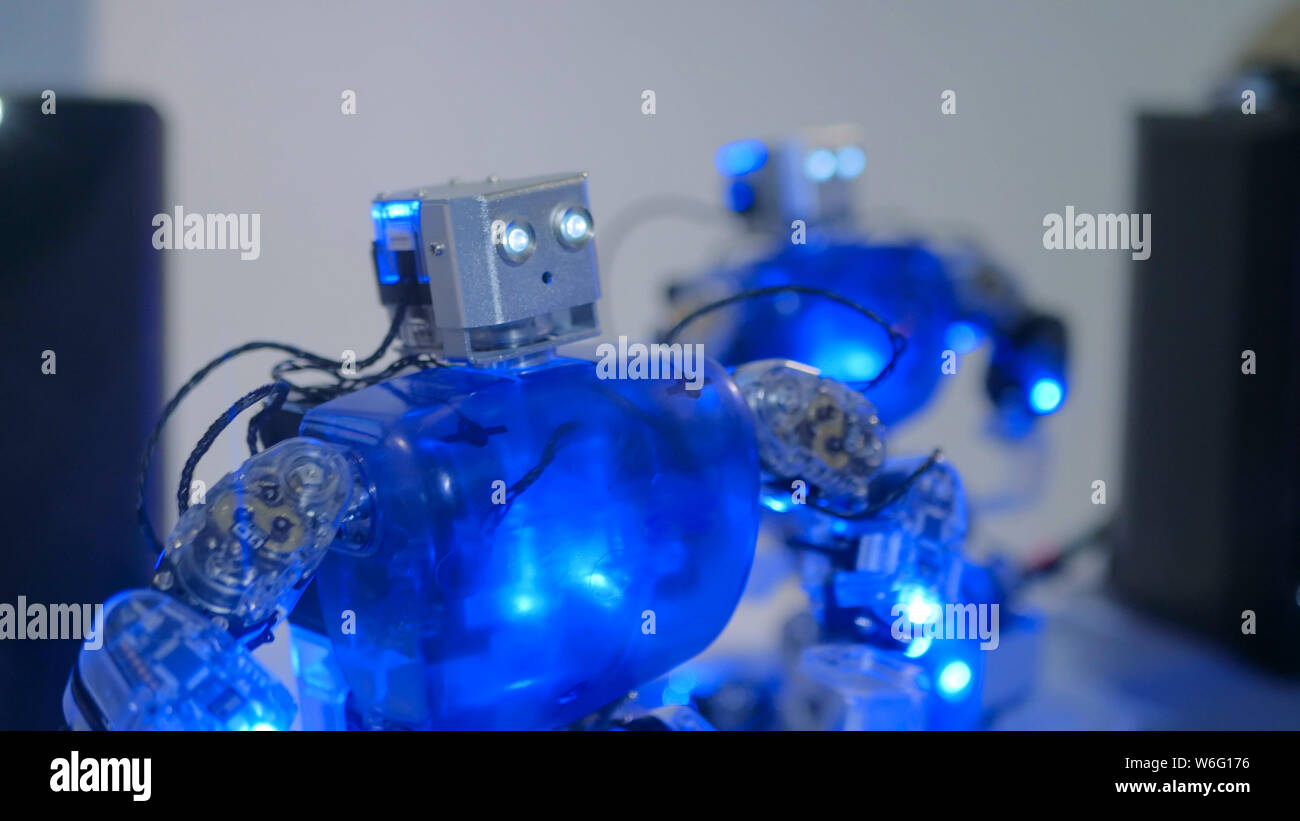 Humanoid robots dancing at robotic show Stock Photo - Alamy