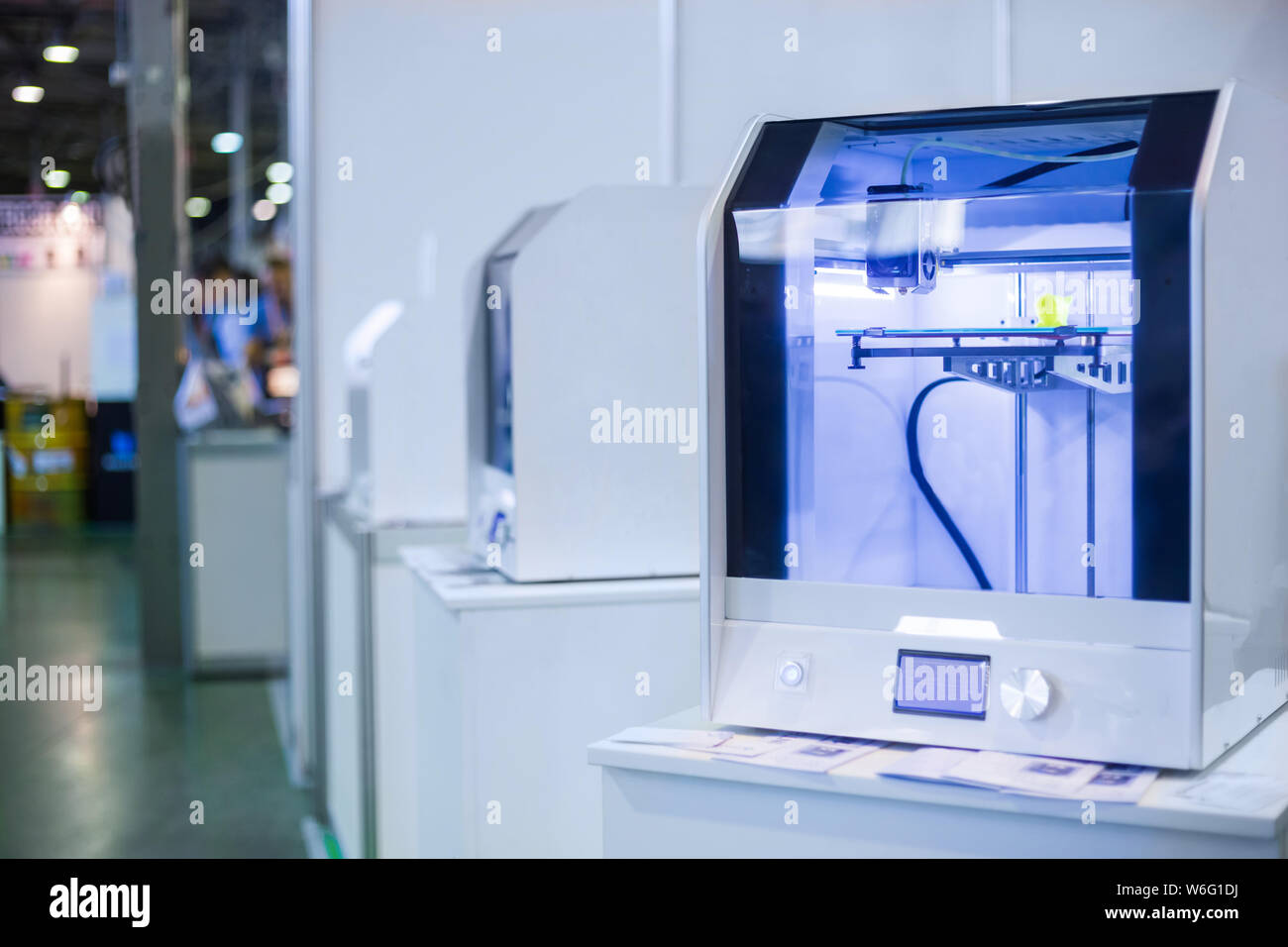 3D printer machine working at modern technology exhibition Stock Photo ...