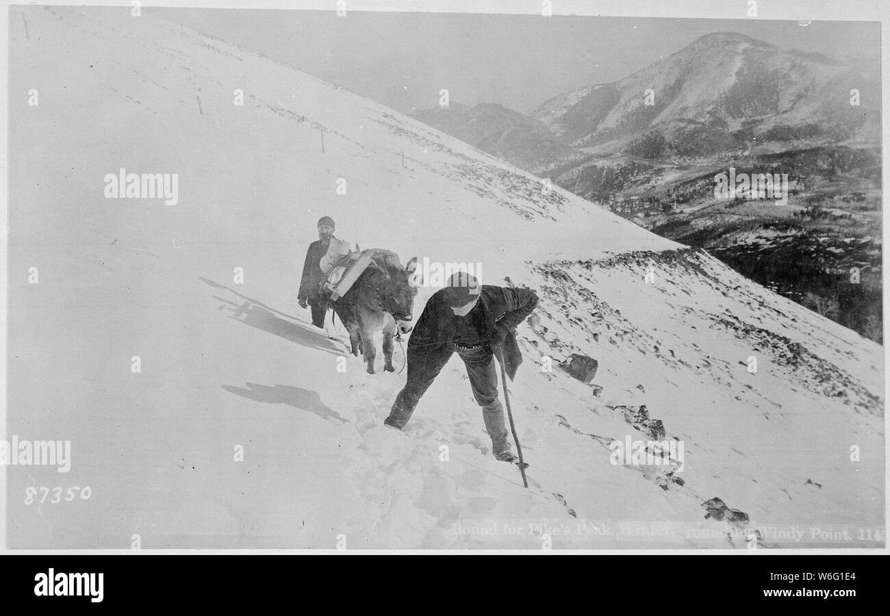 Climbing Pike's Peak, Colorado, in winter, rounding Windy Point, ca ...