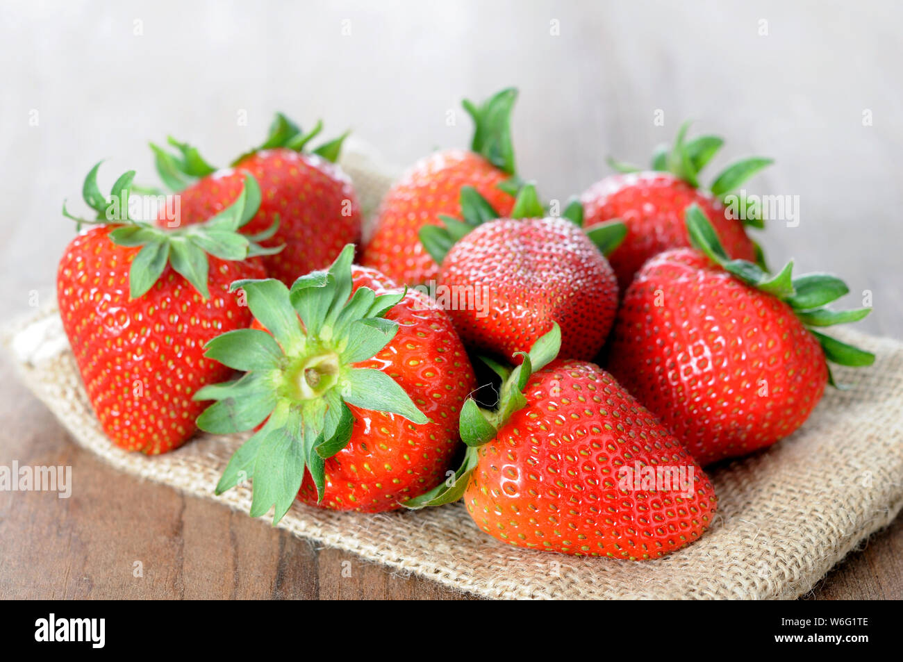 group of fresh strawberry on the table Stock Photo - Alamy