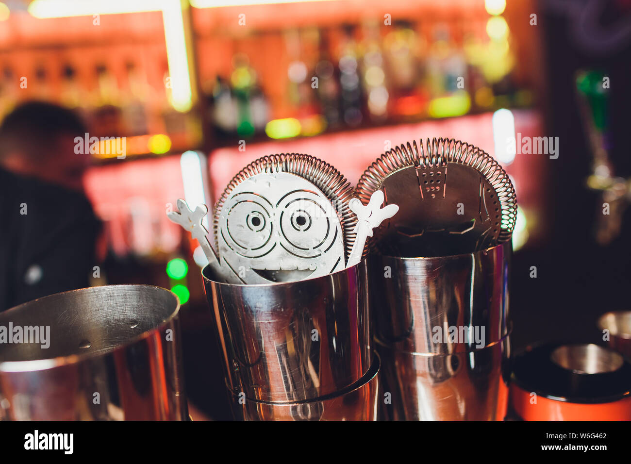 girl bartender preparing cocktail with shaker and bar strainer Stock ...