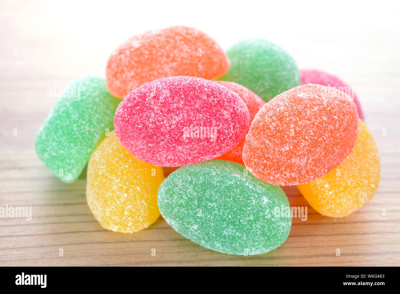 colorful gummy candy on rustic table Stock Photo - Alamy