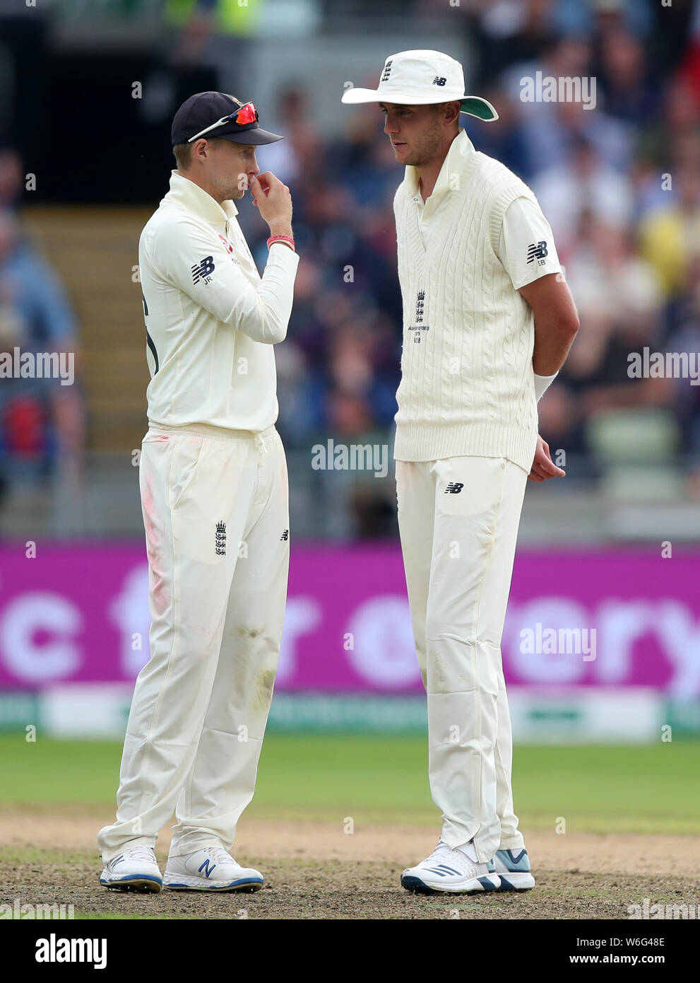 England captain Joe Root (left) speaks to team-mate Stuart Broad during ...