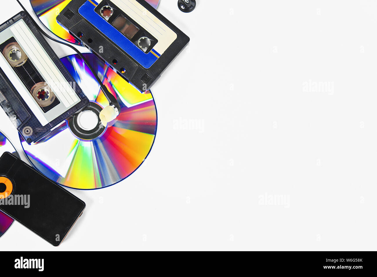 The concept of the evolution of music. Cassette, CD-disk, mp3 player on ...
