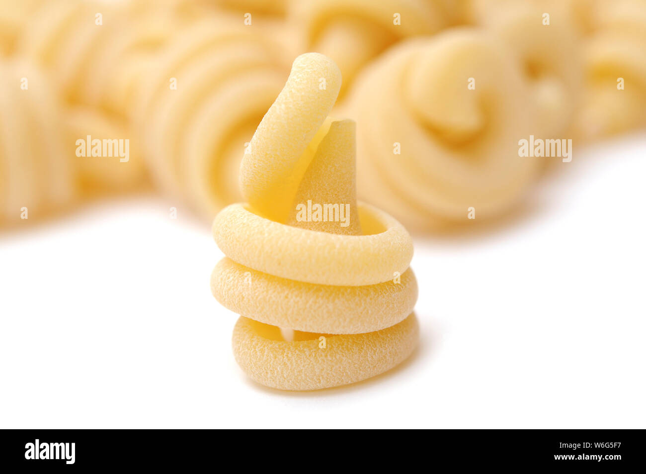 trottole pasta shape on white Stock Photo - Alamy