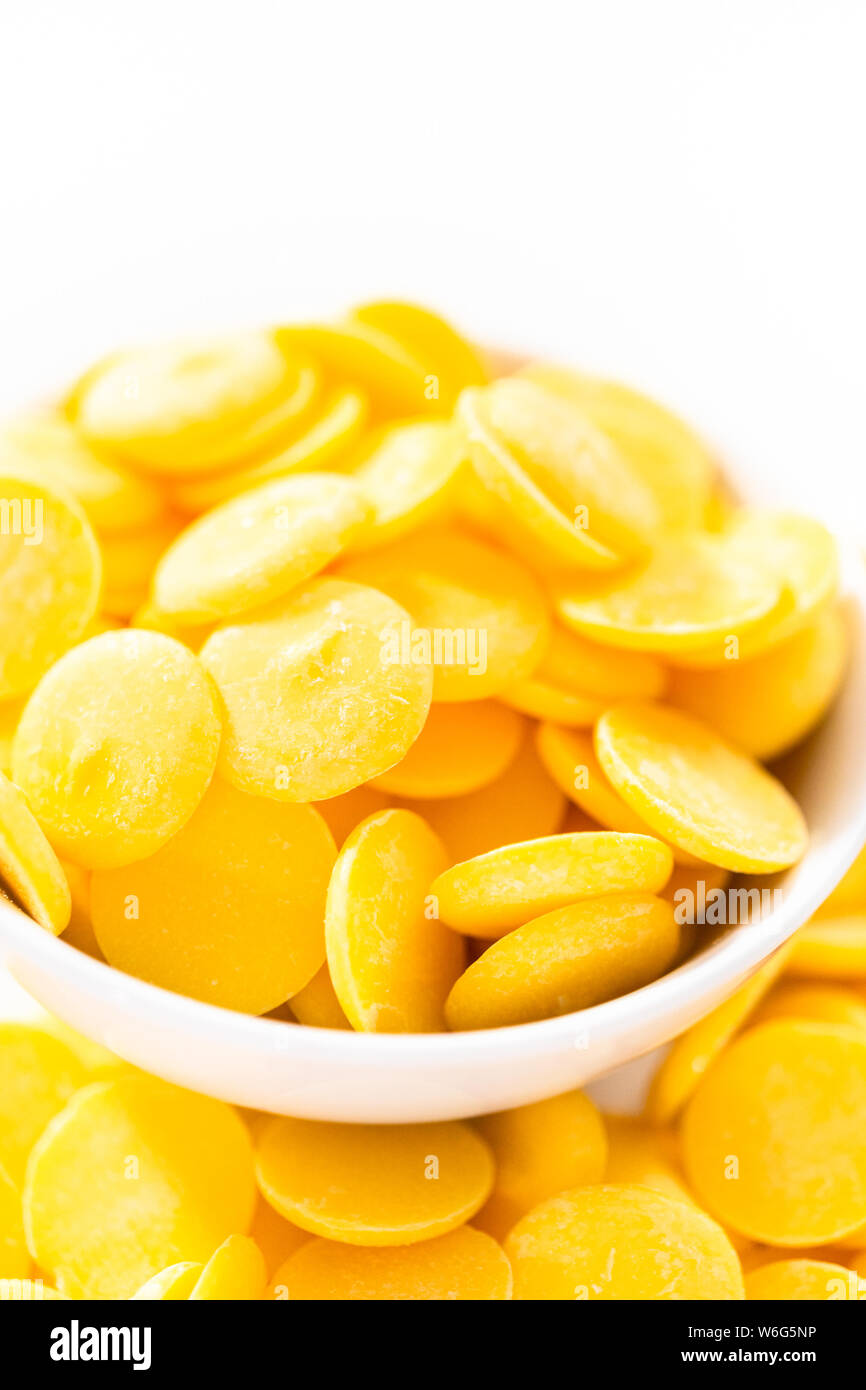 Yellow round chocolate chips for melting chocolate shapes Stock Photo ...