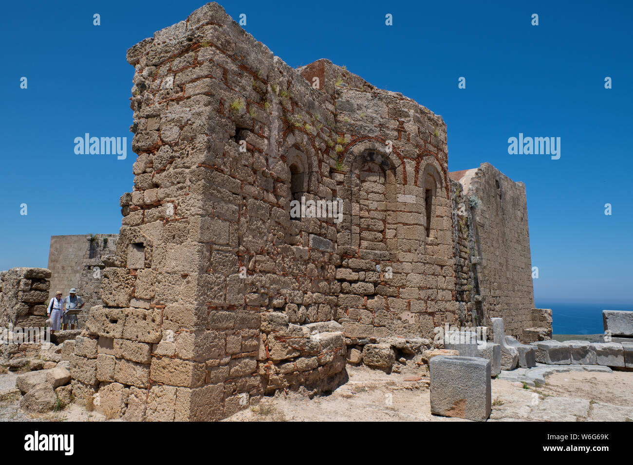 Greece, Rhodes. Historic Lindos, medieval Acropolis of Lindos. Ruins of ...