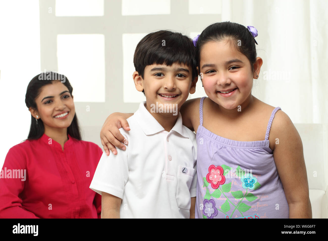 Portrait of two children smiling Stock Photo - Alamy