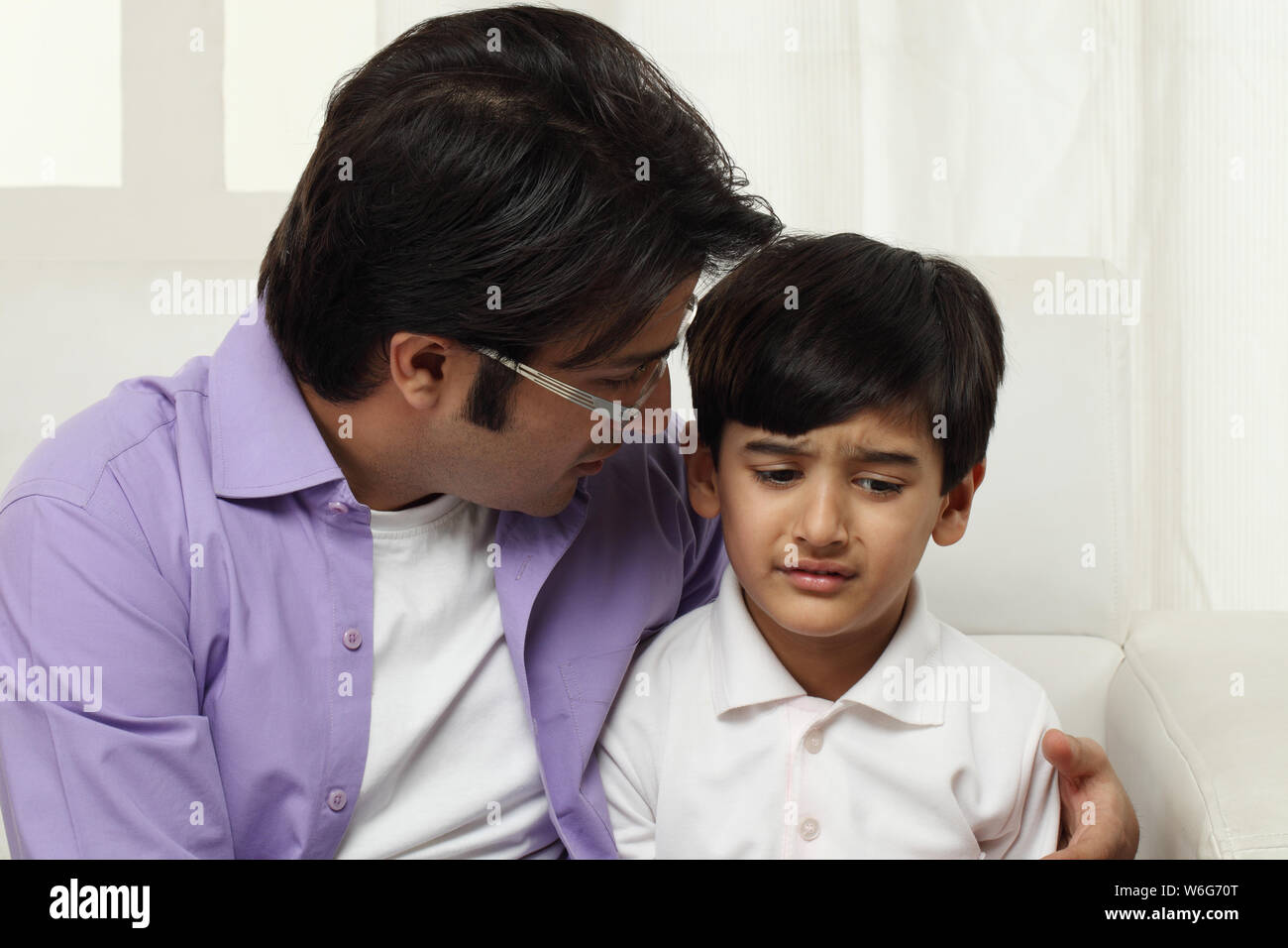 Boy arm around father hi-res stock photography and images - Alamy