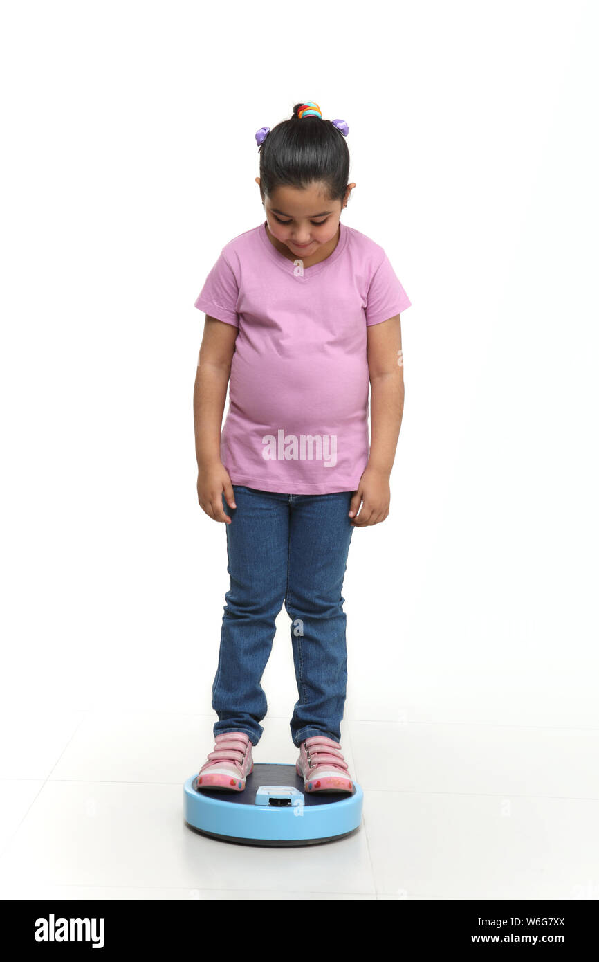 Child standing on scale hi-res stock photography and images - Alamy