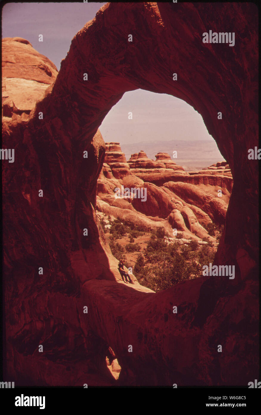DOUBLE O ARCH, ONE OF MANY WINDOWS CARVED INTO VERTICAL REDROCK BY ...