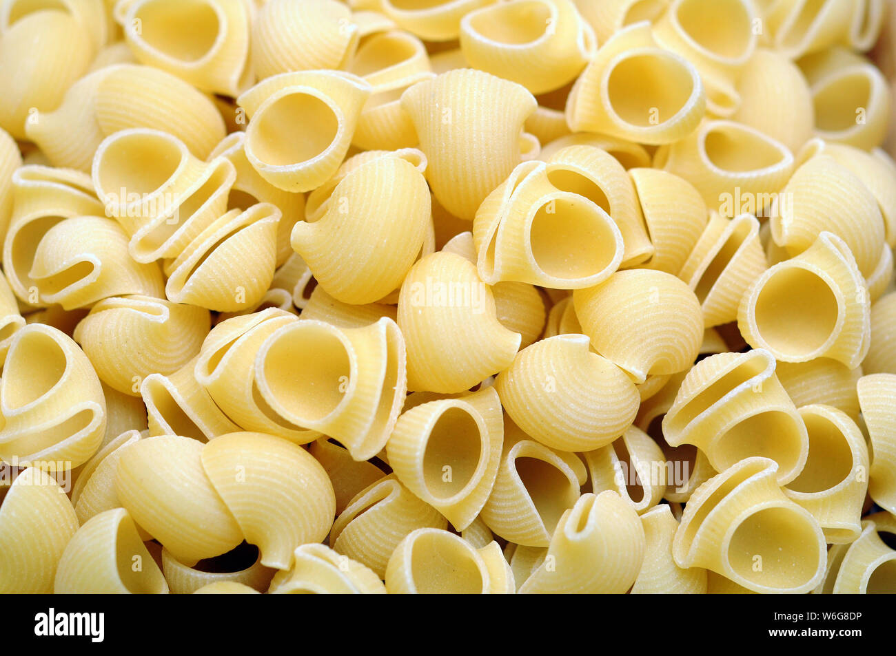 a lot of pipe rigate pasta for background uses Stock Photo - Alamy