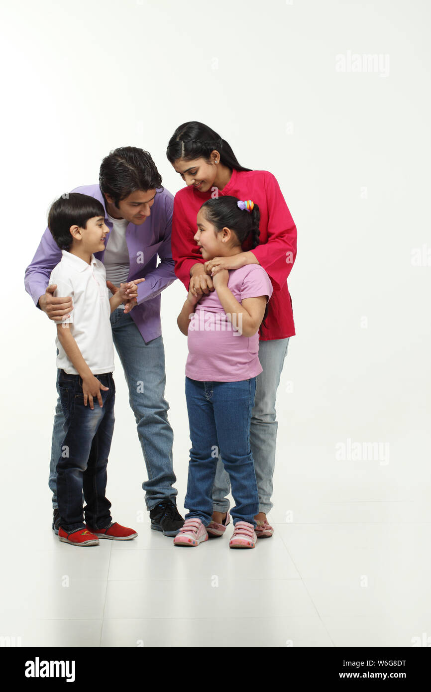 Family standing together Stock Photo - Alamy